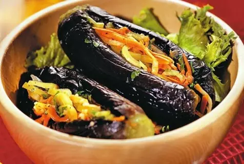Sauer Eggplant bi Carrots Greens and Garlic In A Bowl