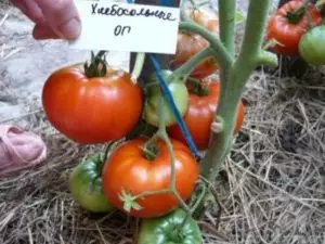 Karakteristisk og beskrivelse af sorten af ​​tomatbrød, dets udbytte