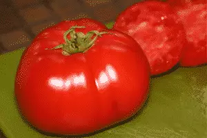 Tomate Premier barietatearen deskribapena, hazteko eta zaintzeko ezaugarriak