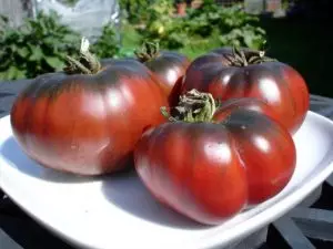 Kenmerkende en beschrijving van de verscheidenheid aan tomaat Negriten, de opbrengst